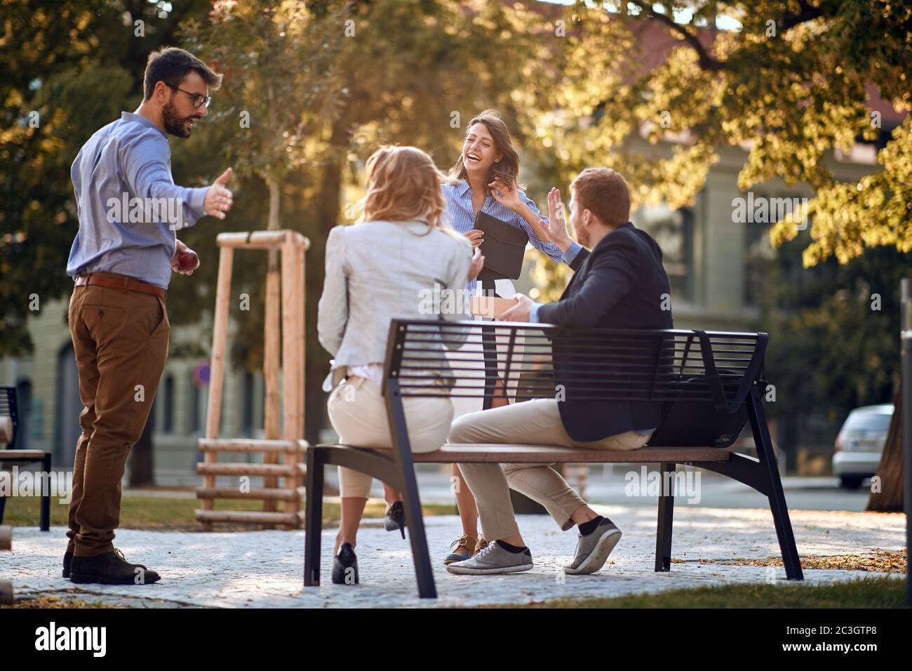 group of young adults, caucasian businesspeople, having break at the ...
