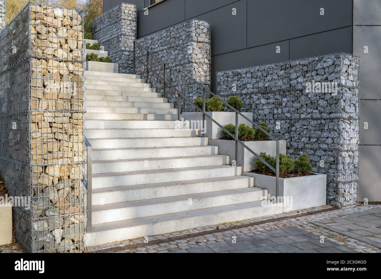 Modern concrete staircase with gabion fence as an eye-catcher Stock ...