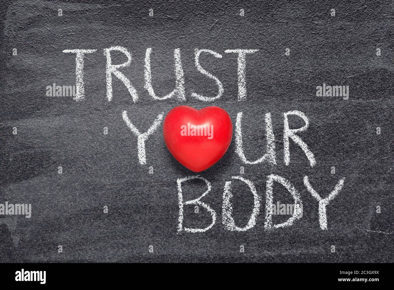 trust your body phrase written on chalkboard with red heart symbol ...