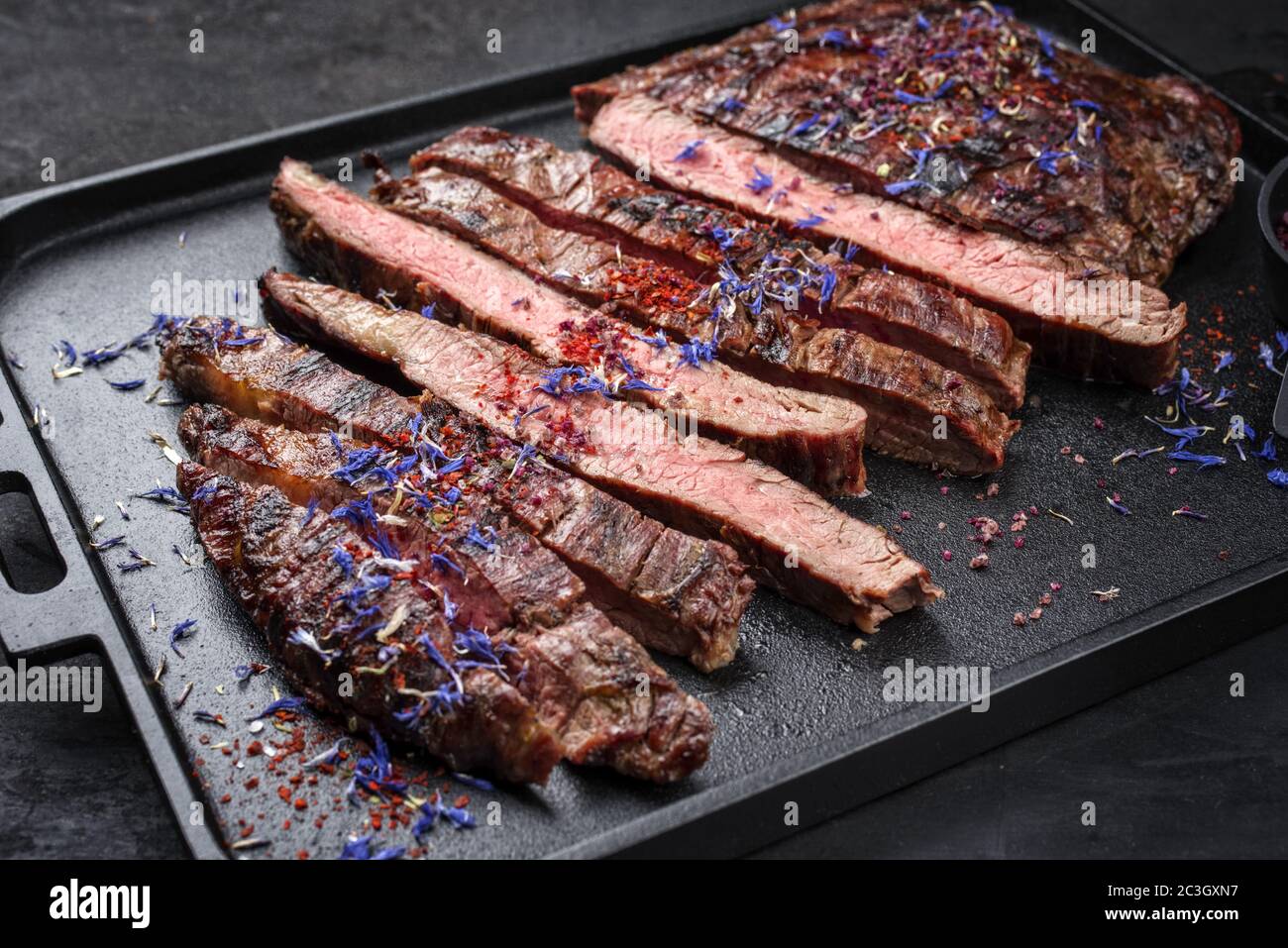 Modern design barbecue dry aged wagyu flank steak offered with herb and ...
