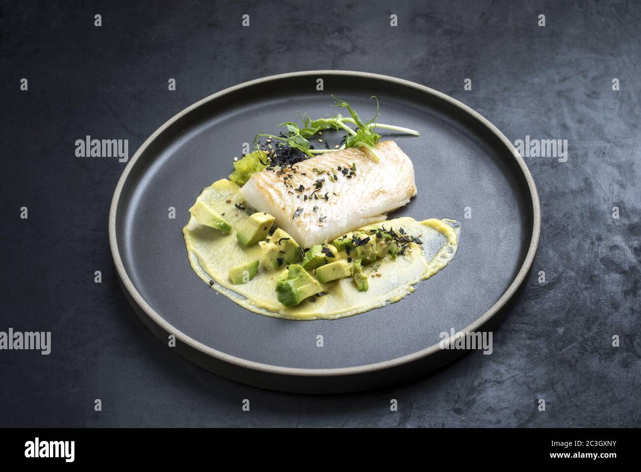 Gourmet fried cod fish filet with caviar Stock Photo - Alamy