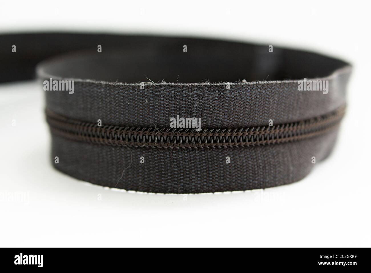 zipper for clothes on white background Stock Photo - Alamy