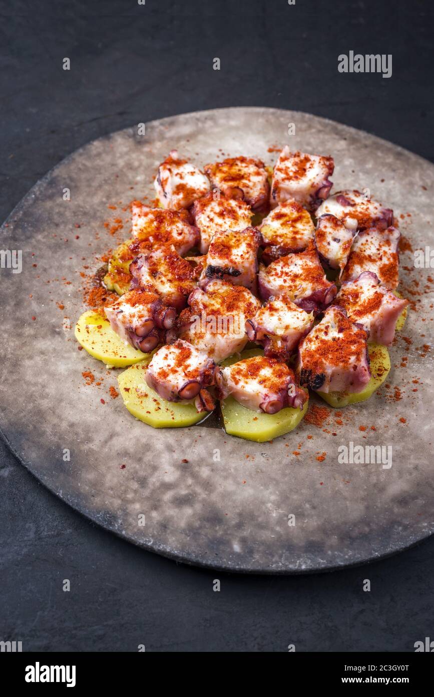 Traditional Spanish pulpo a la gallega with barbecued octopus Stock ...