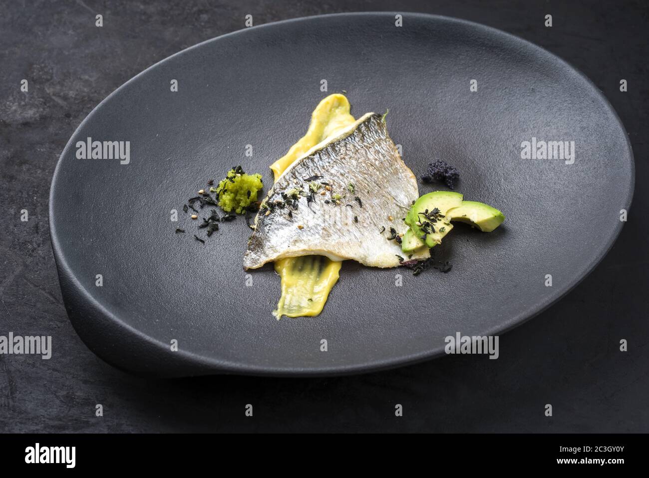 Gourmet fried gilthead fish filet with caviar Stock Photo - Alamy