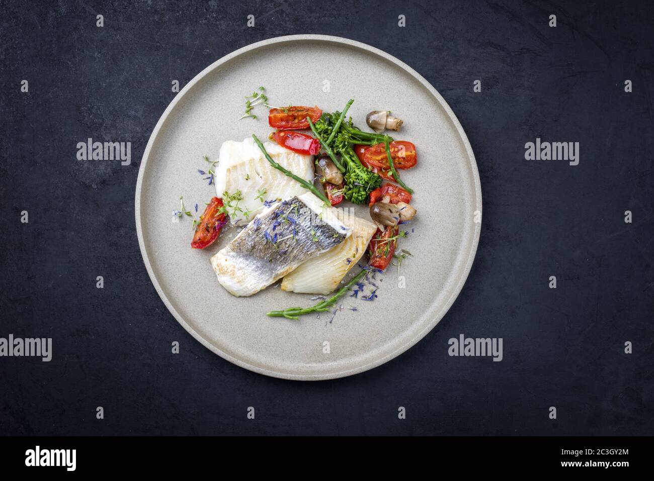 Gourmet fried Italian gilthead fish filet with broccoli Stock Photo - Alamy