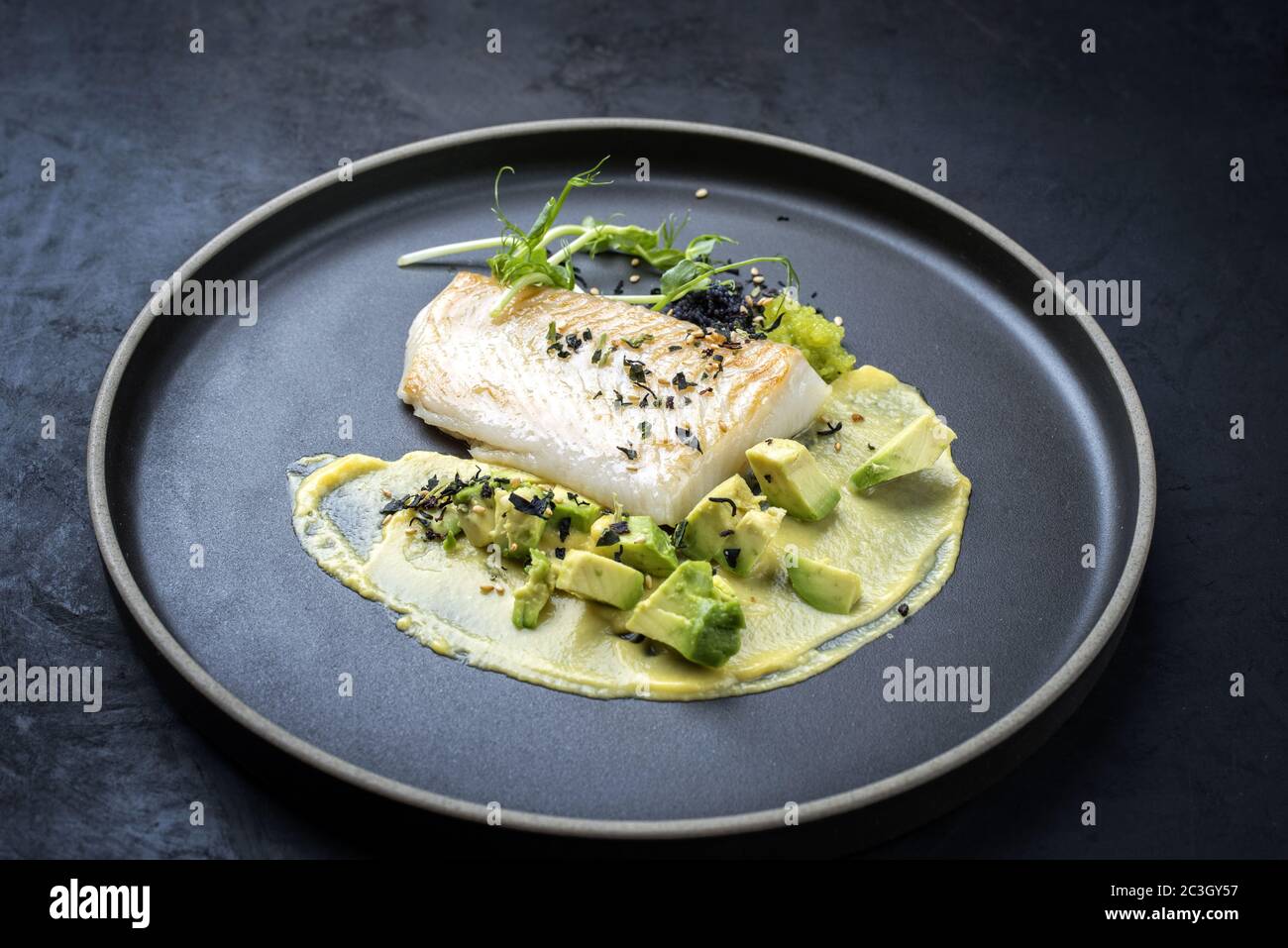 Gourmet fried cod fish filet with caviar Stock Photo - Alamy
