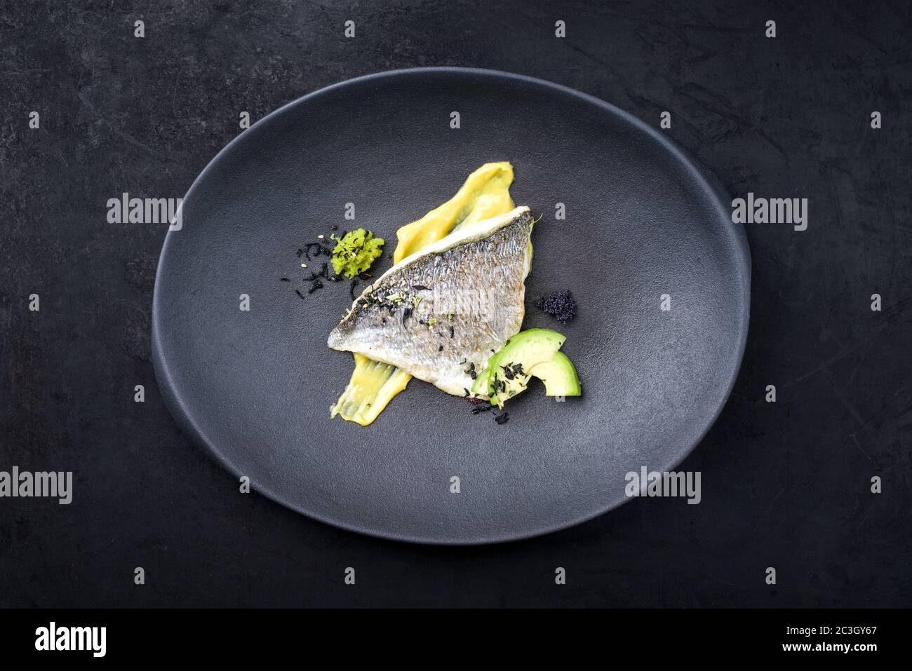 Gourmet fried gilthead fish filet with caviar Stock Photo - Alamy