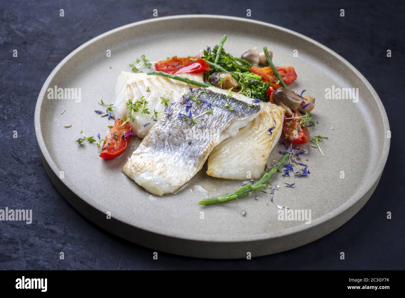 Gourmet fried Italian cod fish filet with broccoli Stock Photo - Alamy