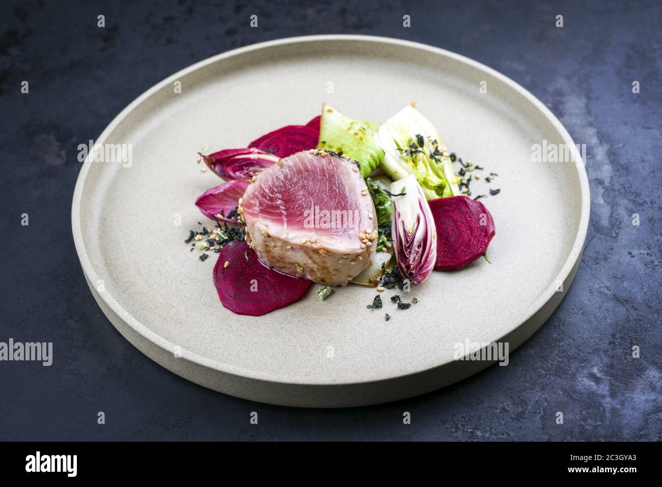 Japanese gourmet fried tuna fish steak tataki with pak choi Stock Photo ...