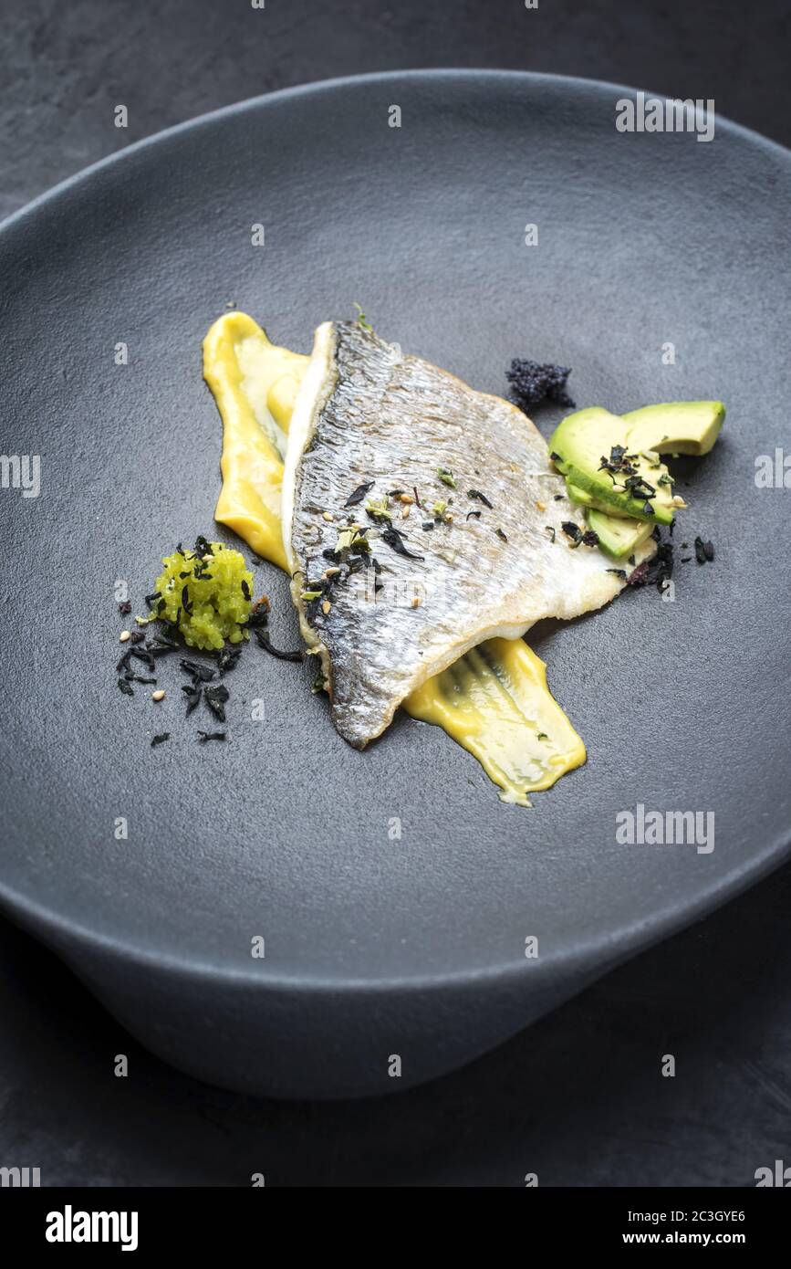 Gourmet fried gilthead fish filet with caviar Stock Photo - Alamy