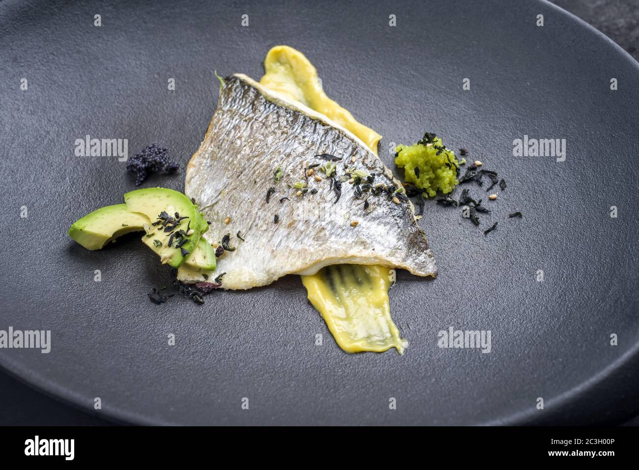 Gourmet fried gilthead fish filet with caviar Stock Photo - Alamy