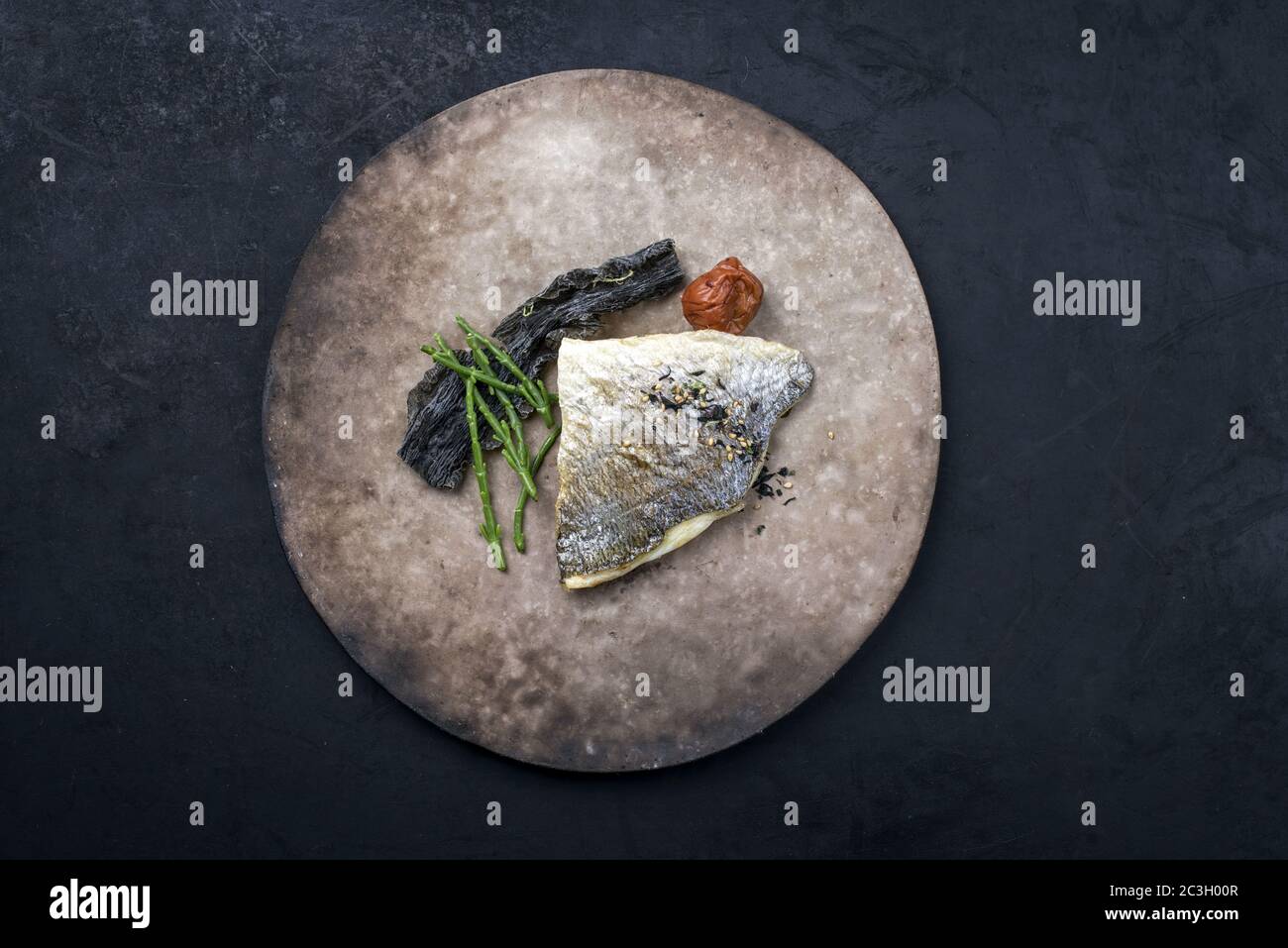Japanese gourmet fried gilthead fish filet with glasswort Stock Photo ...