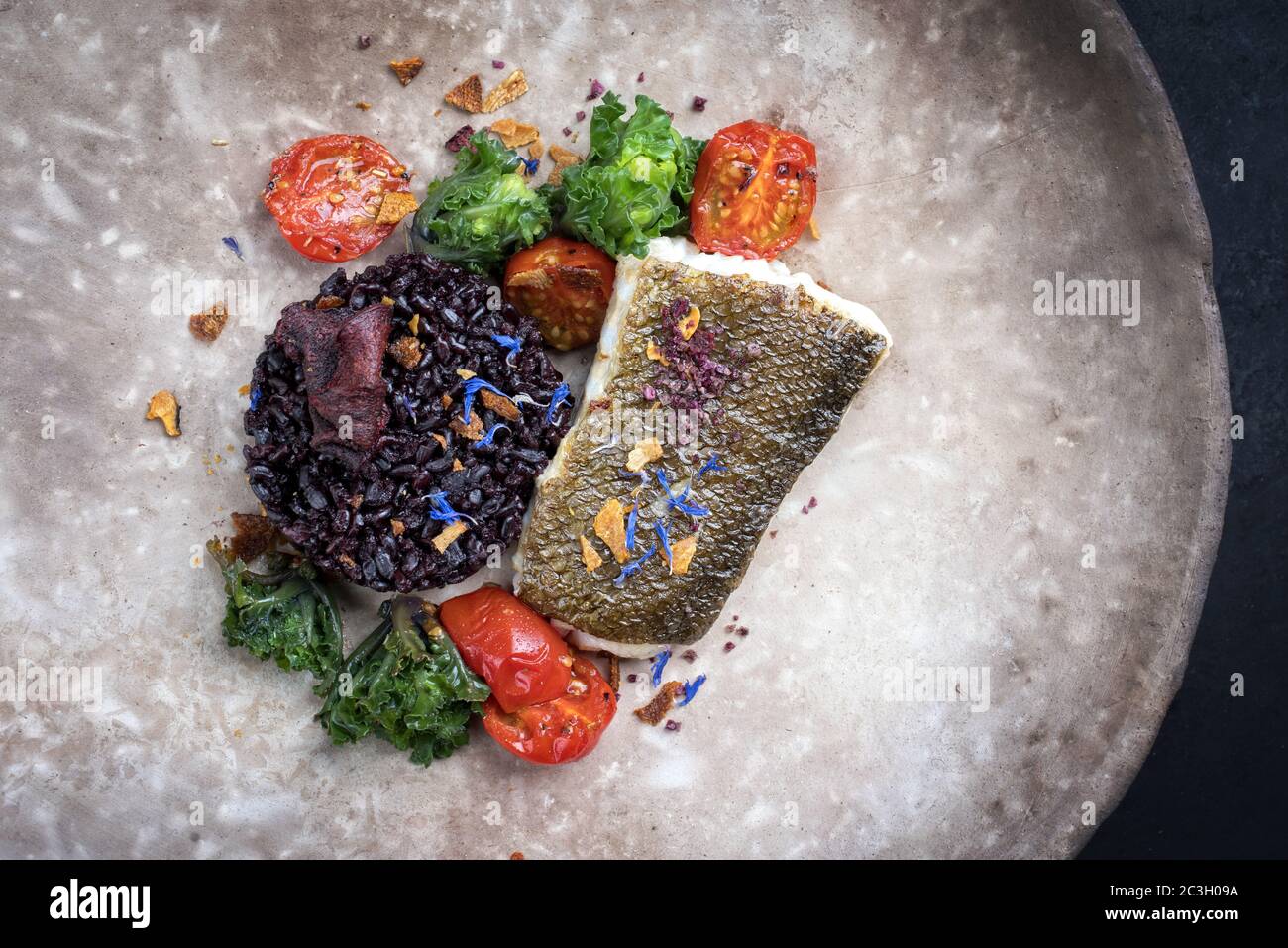 Gourmet fried European skrei cod fish filet with kalette and black ...