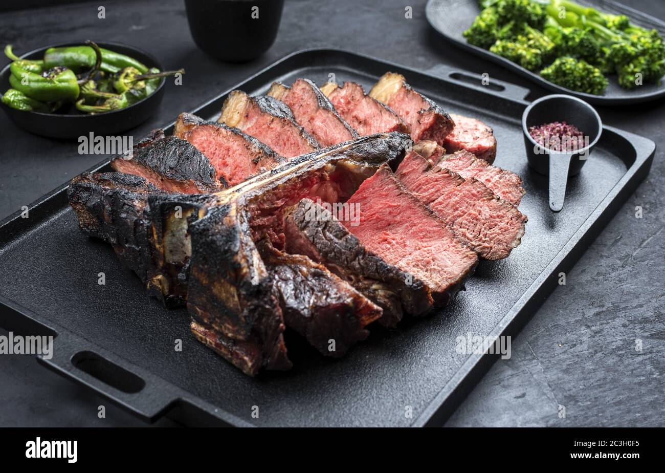 Barbecue dry aged wagyu porterhouse beef steak sliced with large fillet ...