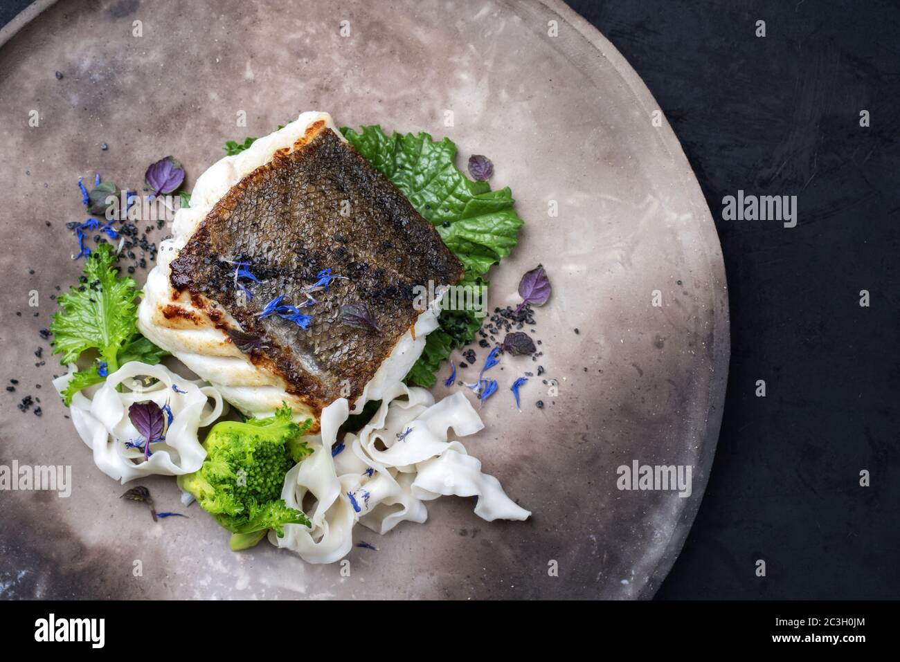 Gourmet fried European skrei cod fish filet with rapini broccoli rabe ...