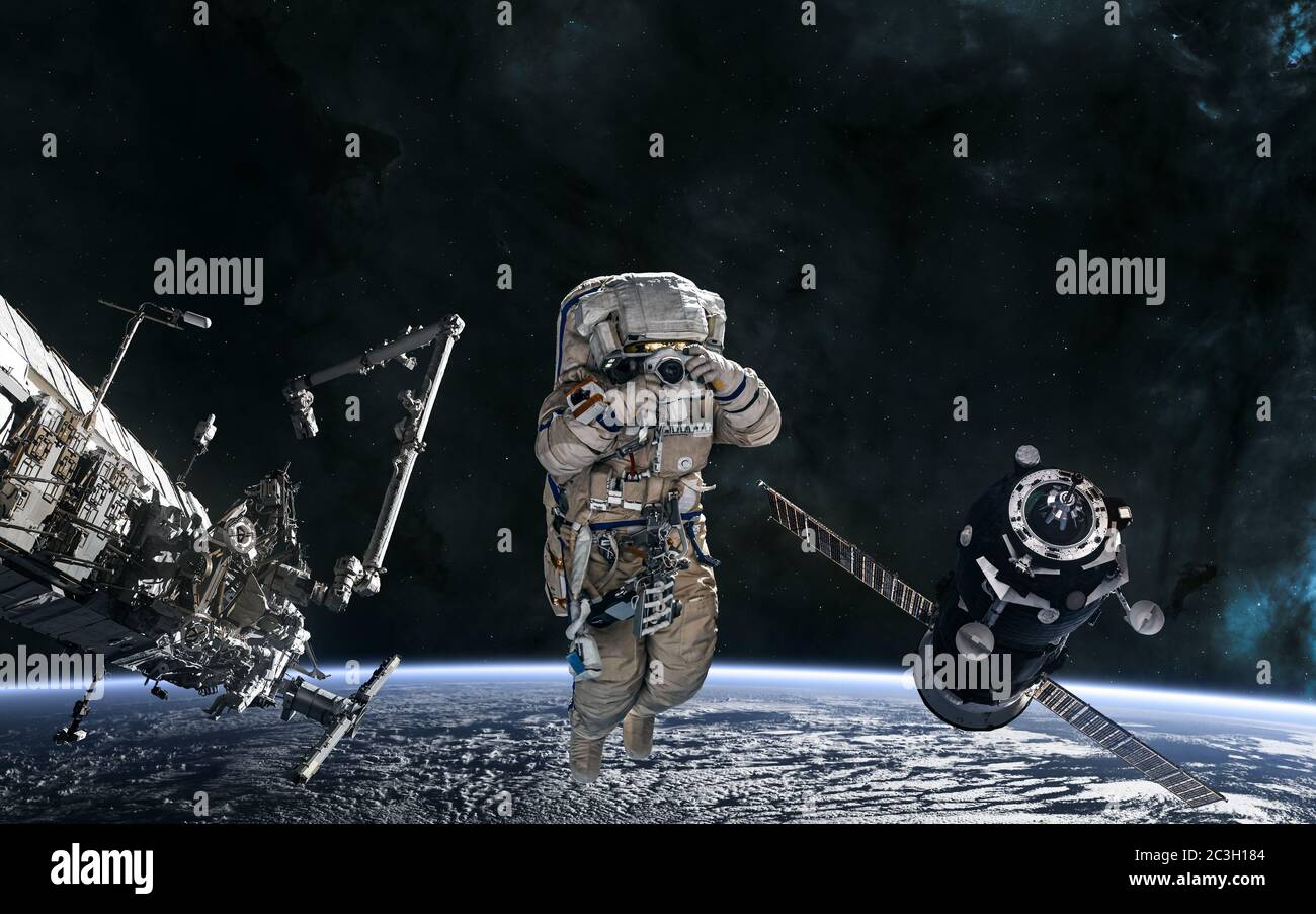 Astronaut, space stations in orbit of planet Earth. Solar system Stock ...