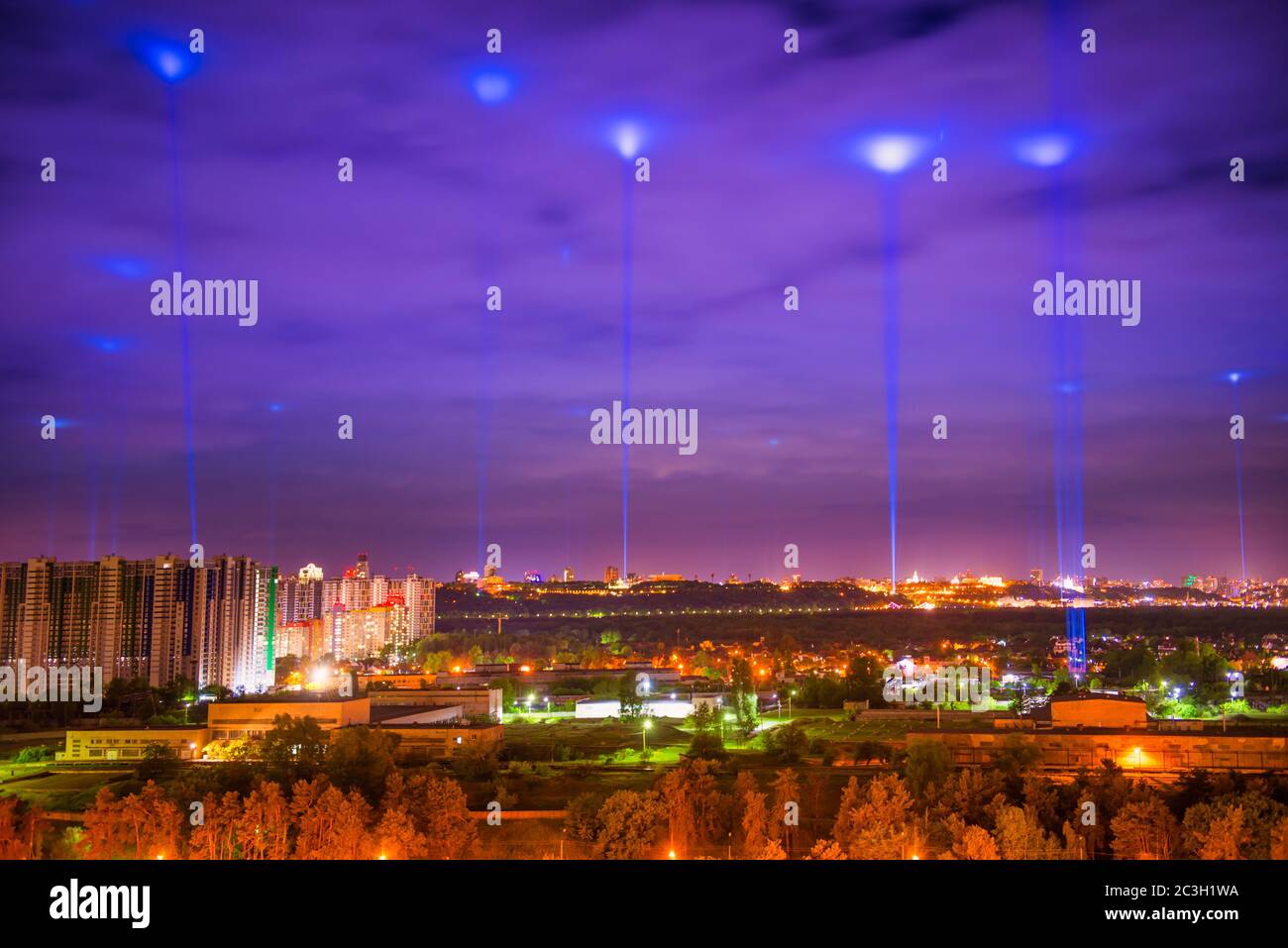 Night illuminated city with blue lights Stock Photo - Alamy