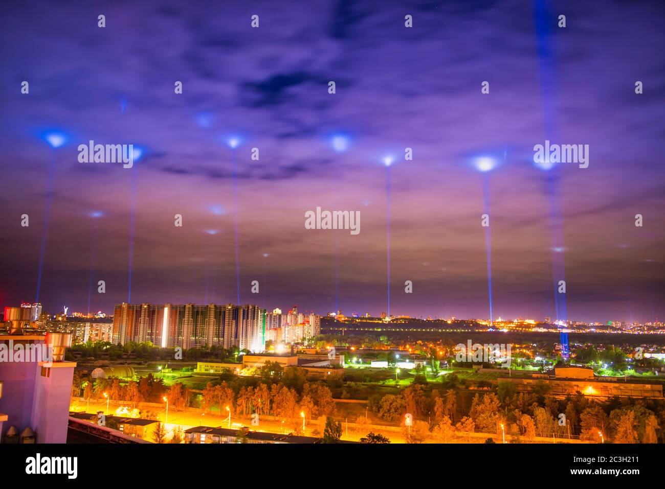 Night illuminated city with blue lights Stock Photo - Alamy