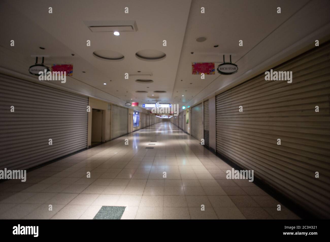 Empty shopping mall corridor during closing hours Stock Photo - Alamy