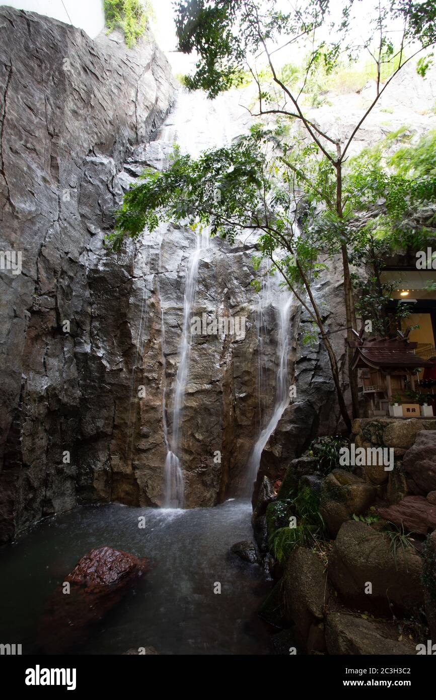 Vertical shot of an artificial waterfalls Stock Photo - Alamy