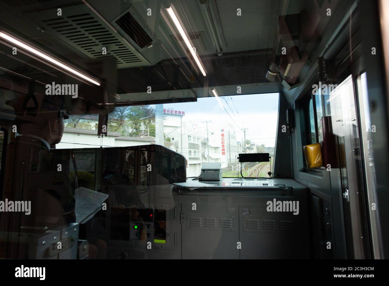 Front interior of of a city tour bus with a bus driver Stock Photo - Alamy