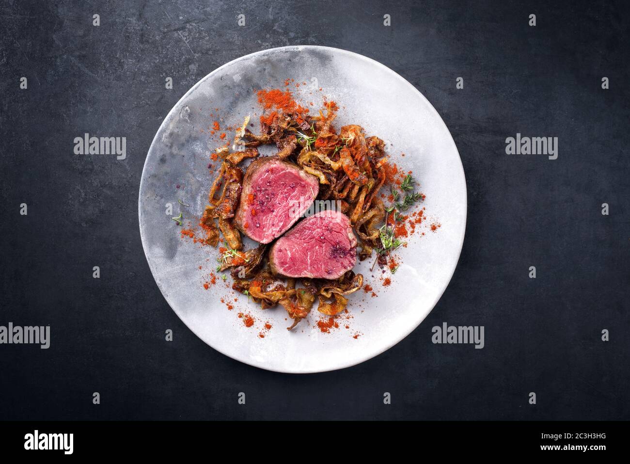 Barbecue dry aged beef fillet medallion steak natural with fried onion ...