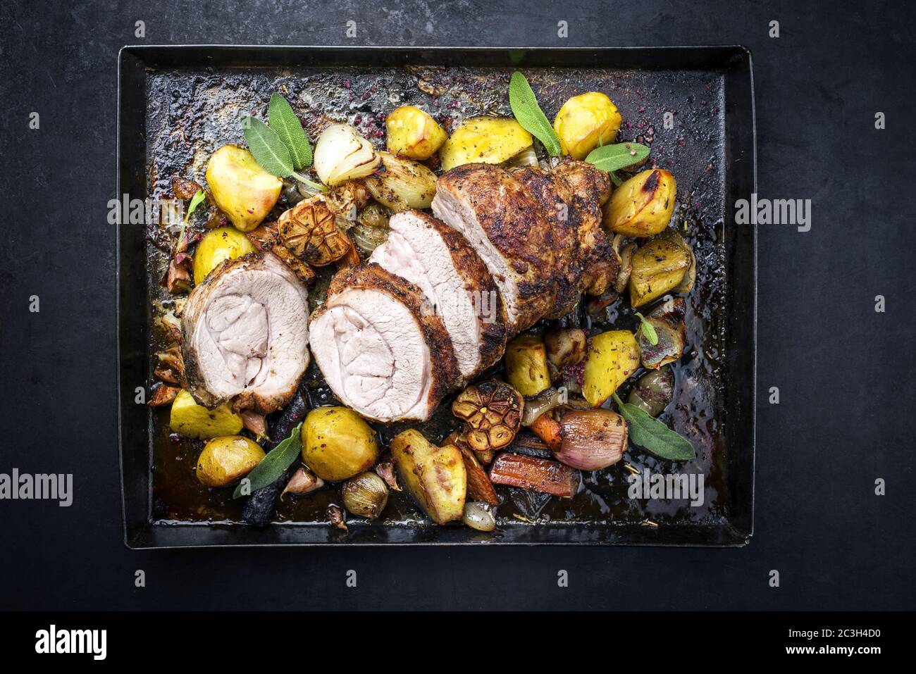 Traditional roasted veal roll roast offered with potatoes Stock Photo ...