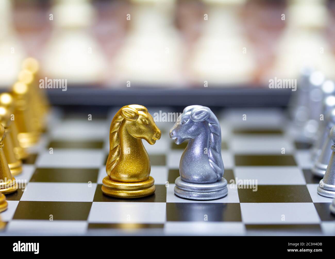 Shot of a chess board Gold horse meets silver horse,Business ...