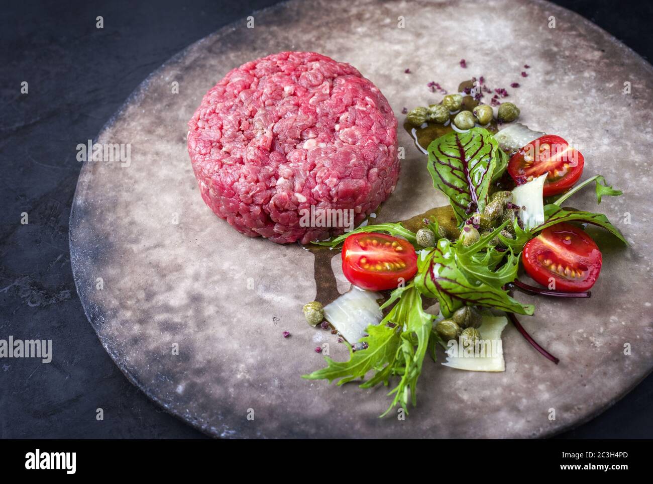 Gourmet tartar raw from beef fillet with lettuce Stock Photo - Alamy