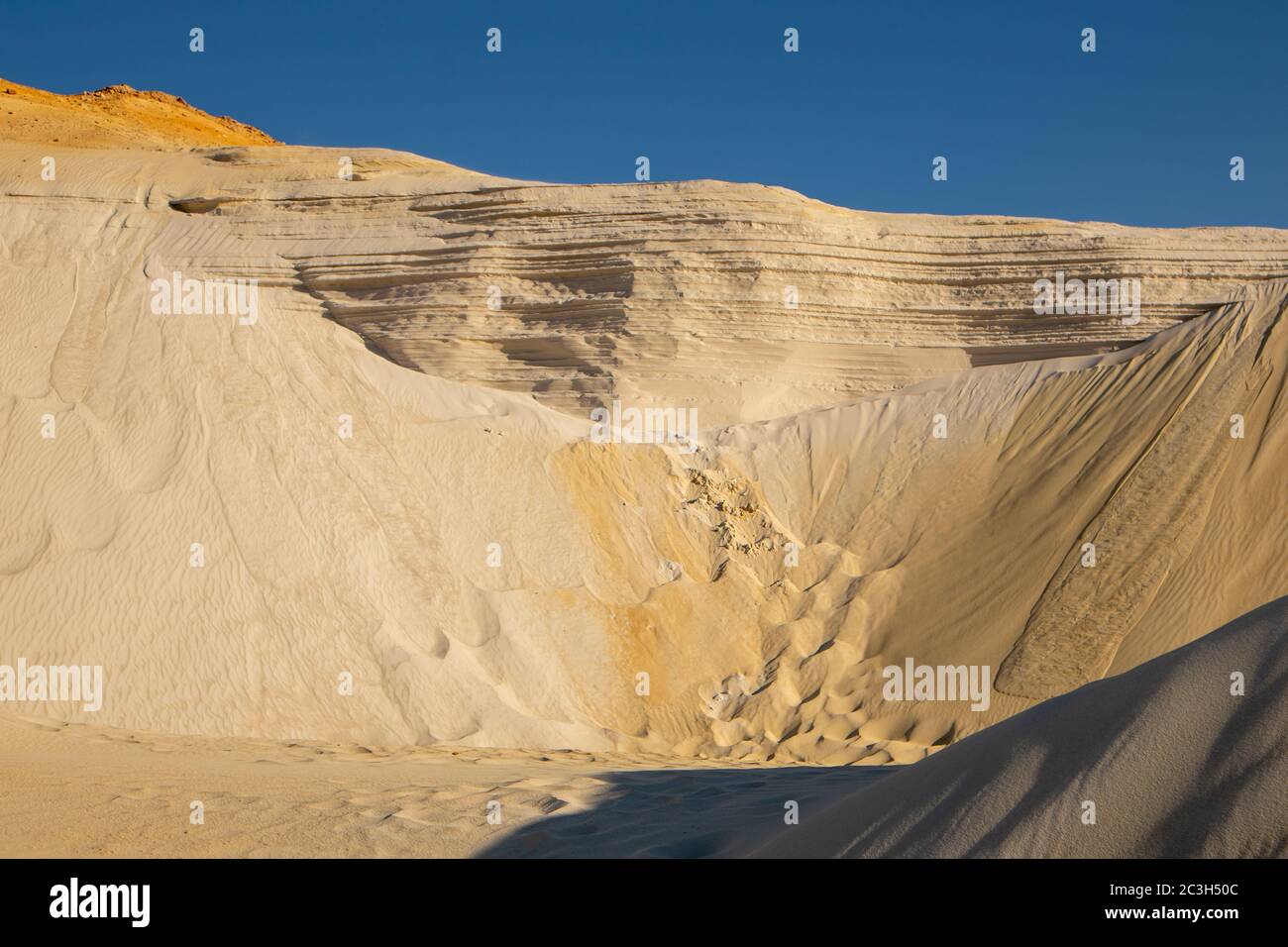White sand and blue sky. Embossed sand mountains of white sands. Desert ...