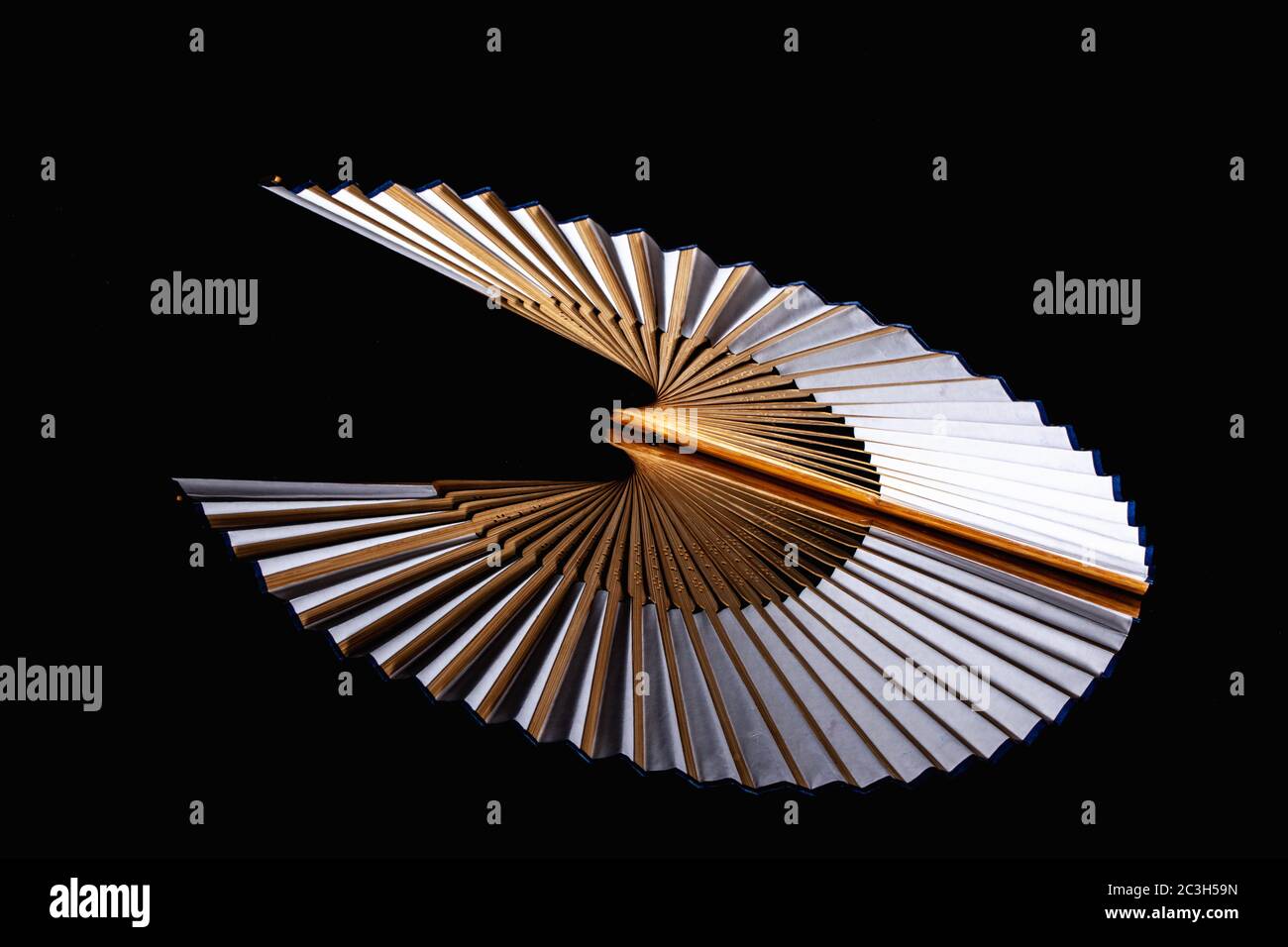 Bamboo open hand fan isolated on a black background. Traditional ...