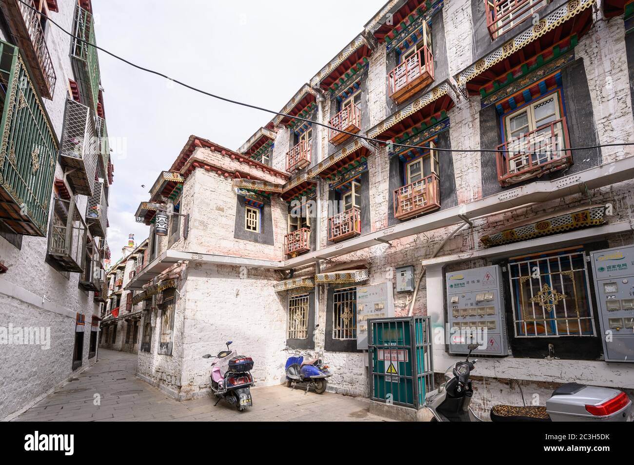 Typical side street in downtown Lhasa, Tibet with Tibetan architecture ...