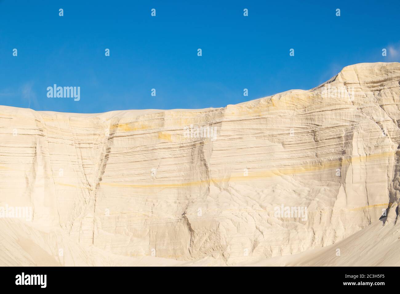 White sand and blue sky. Embossed sand mountains of white sands. Desert ...