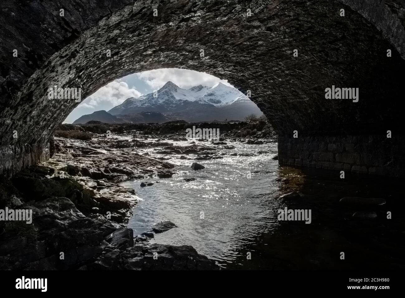The famous Sligachan Old Bridge looking towards the Cuillin mountain ...