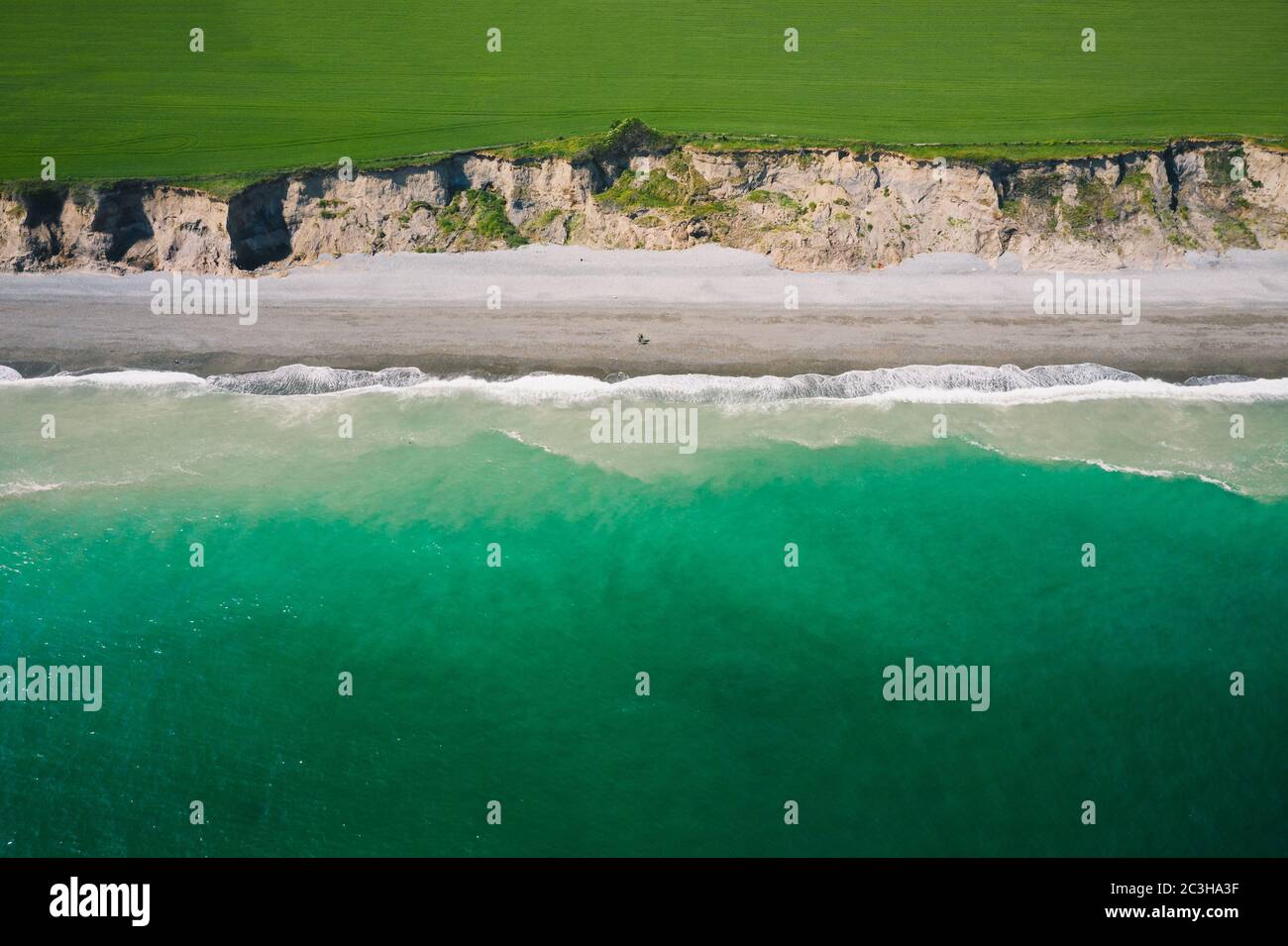 Aerial view of typical Irish landscape with cliffs, green grass, empty ...