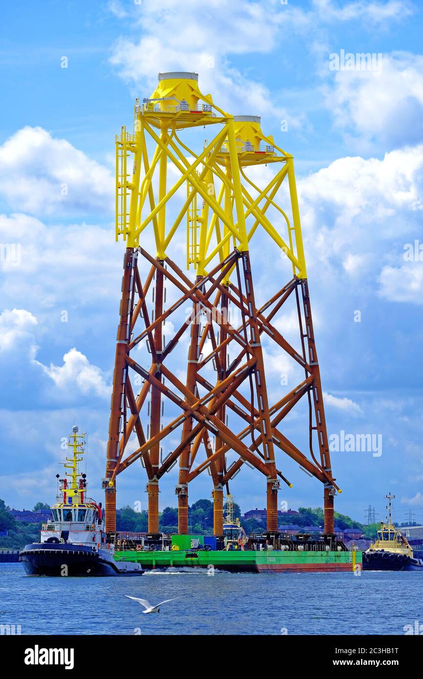 Multratugs towing 2 large completed wind turbine from Smulders yard ...