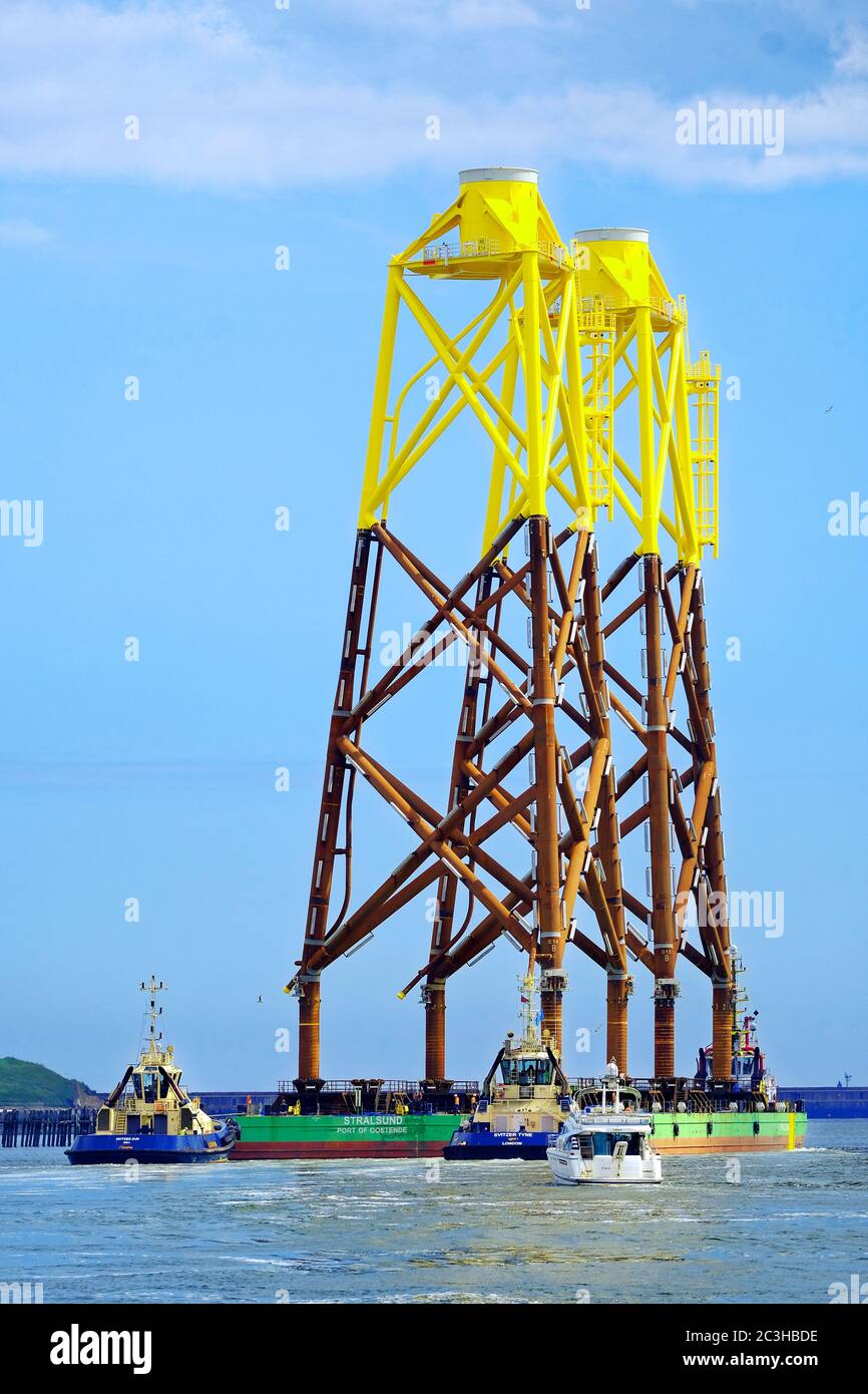 Multratugs towing 2 large completed wind turbine from Smulders yard ...