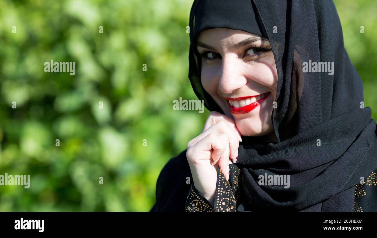 Beautiful young muslim woman smiles broadly Stock Photo - Alamy