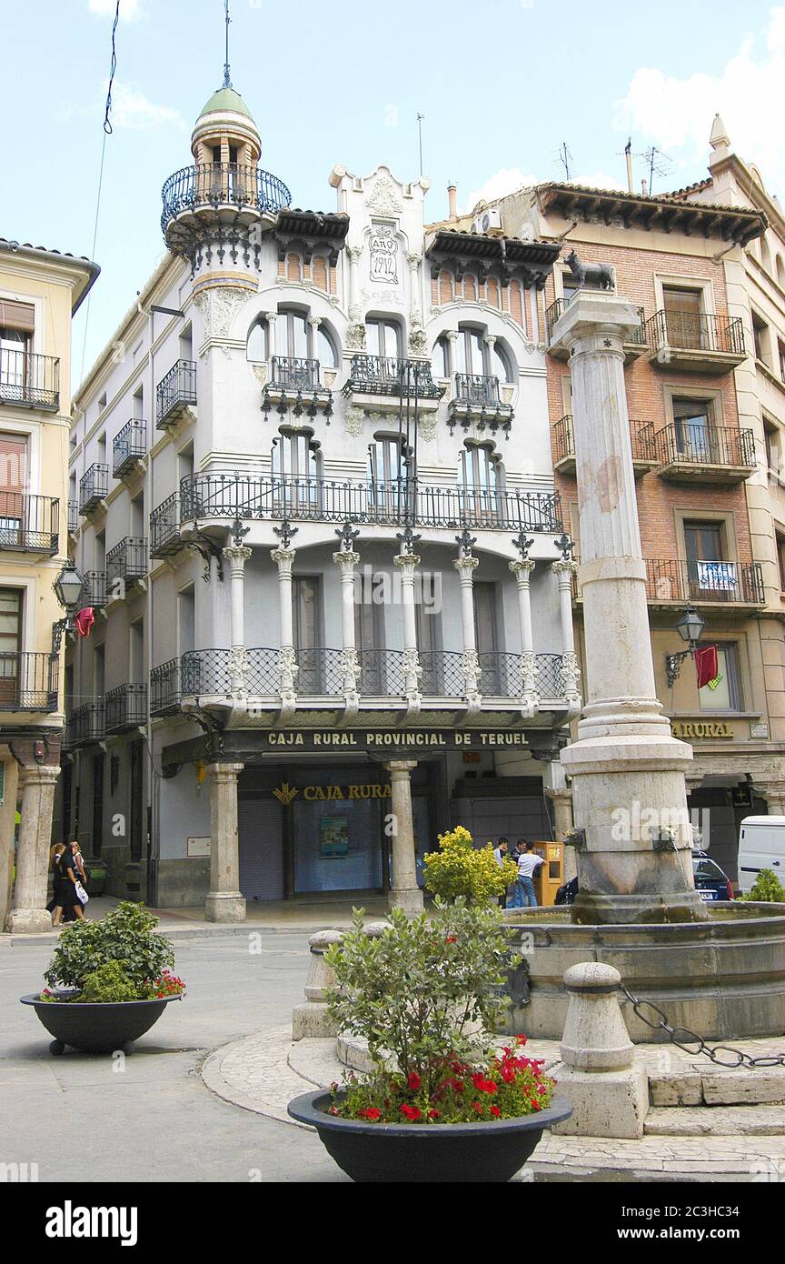 TERUEL, SPAIN - Sep 06, 2004: Monument of Torico and modernist building ...