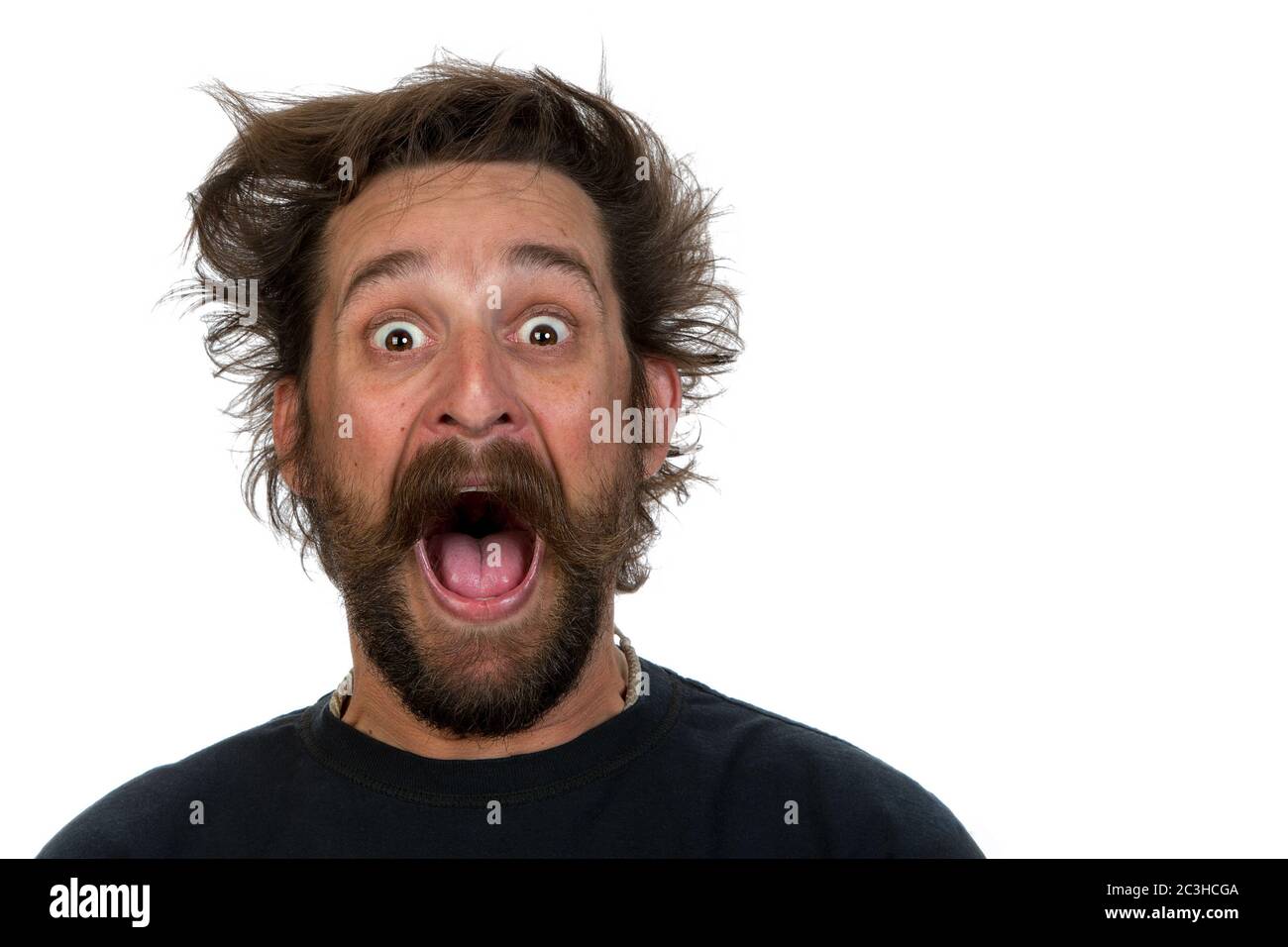 Goofy young man, with full beard and moustache and wild hair style ...