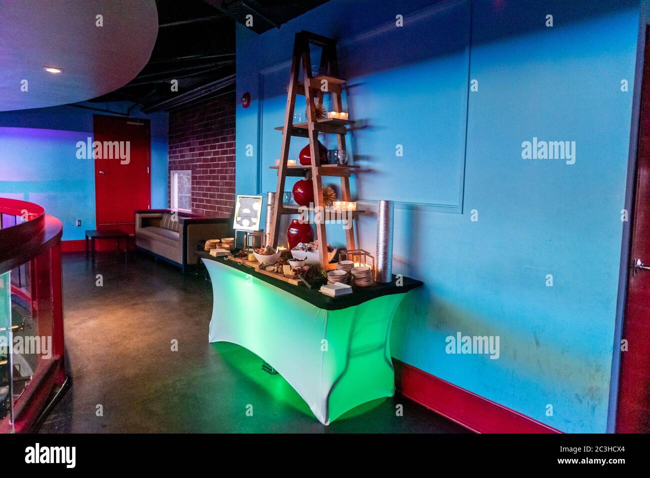 Green neon light table decorated with still life objects indoors Stock ...