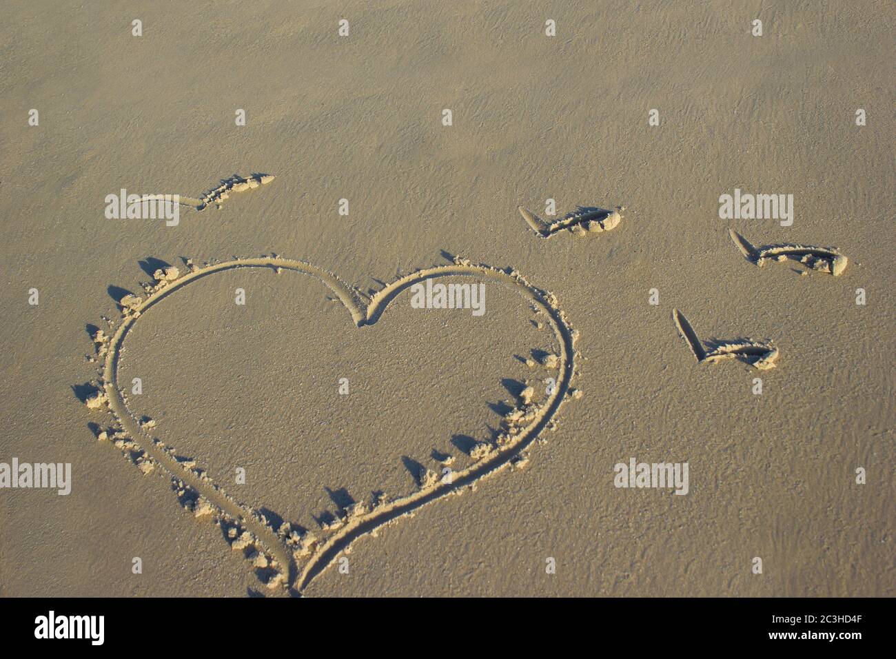 Lettering love, heart on sand sunrise background sea, horizon beach ...