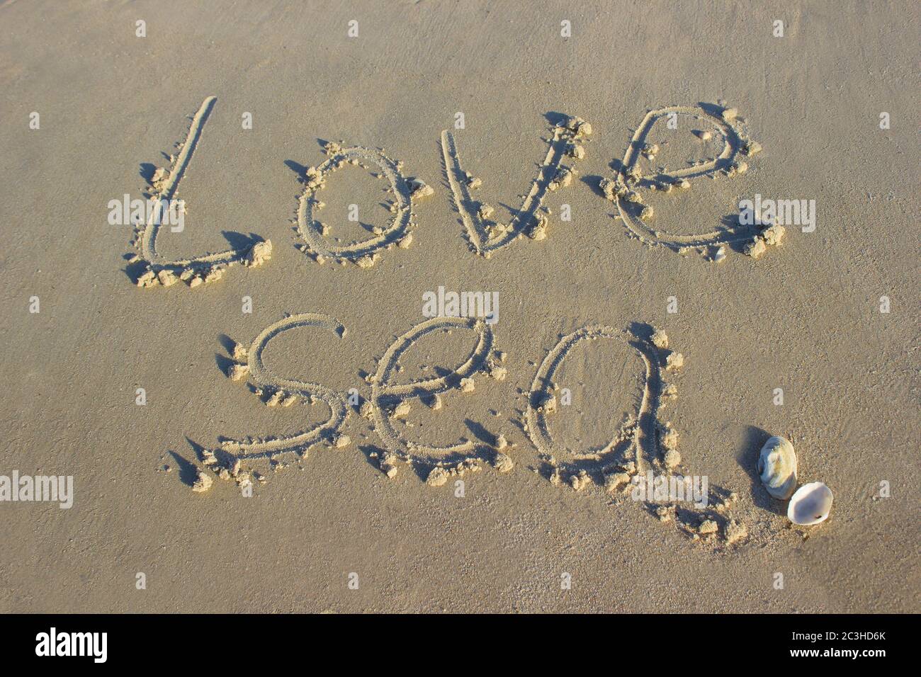 Lettering love sea on sand sunrise background sea, horizon beach dawn ...