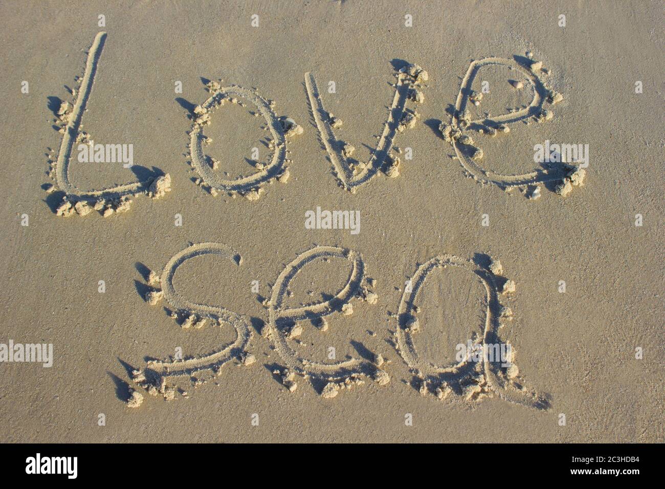 Lettering love sea on sand sunrise background sea, horizon beach dawn ...