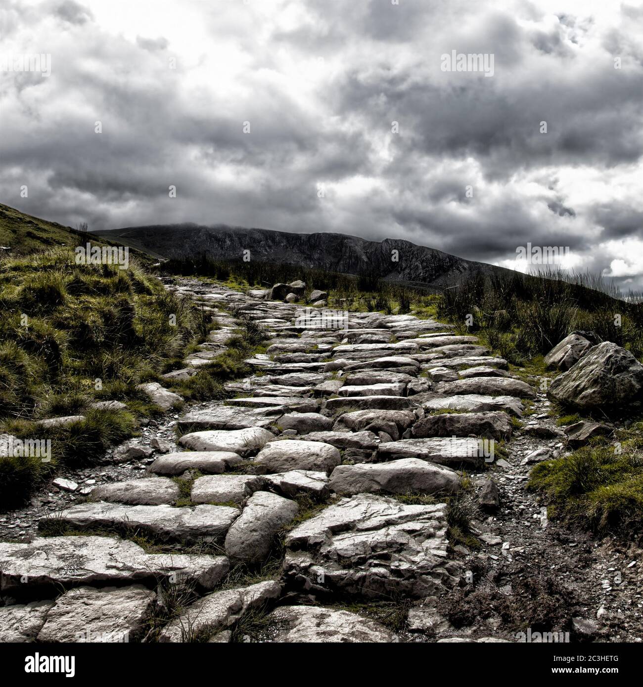 Dramatic depiction of the dry stone hikers path leading to the summit ...