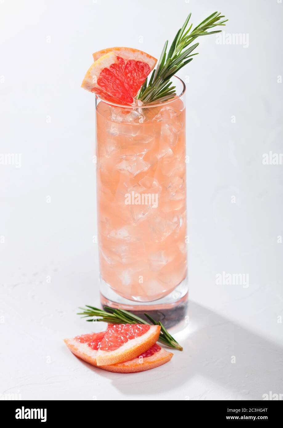 Highball glass of cocktail with red grapefruit and gin with vodka with ...