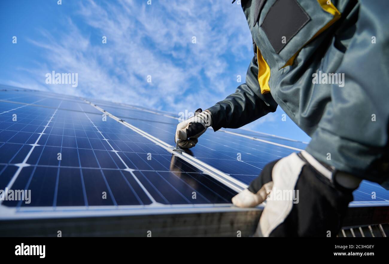 Close up of man technician in work gloves installing stand-alone ...