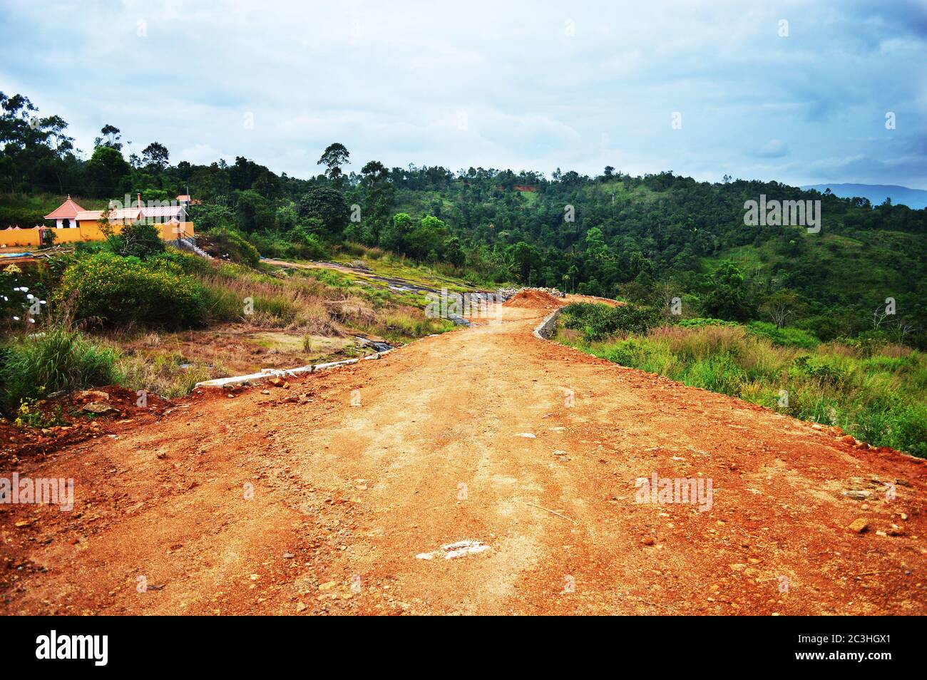 A country mud road leading to valley Stock Photo - Alamy