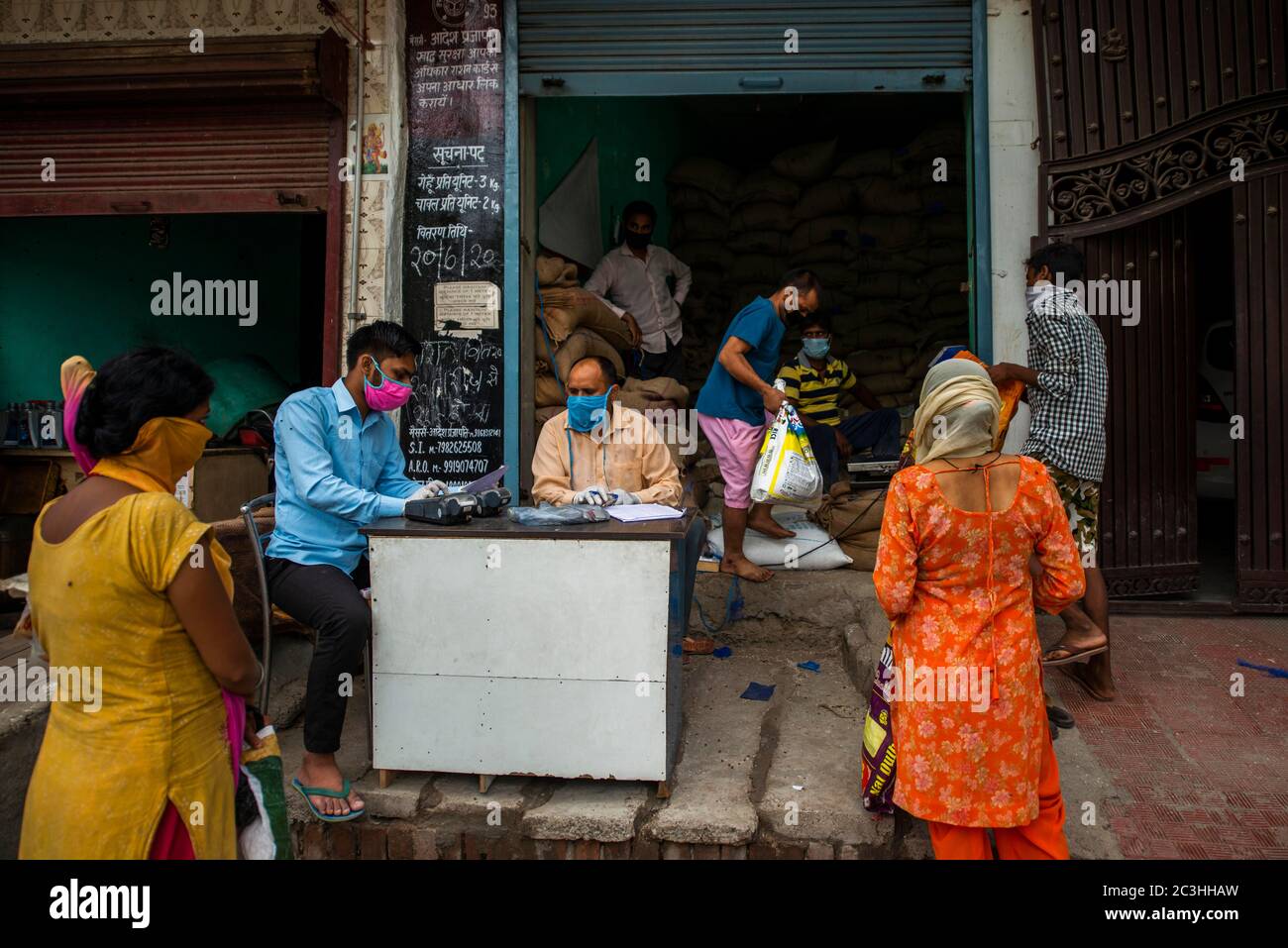 A view of people outside the ration shop during the distribution ...