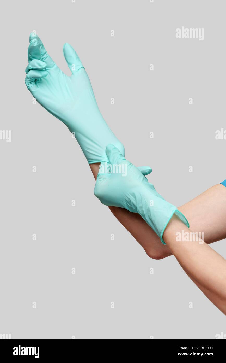 Wearing rubber surgical gloves hi-res stock photography and images - Alamy